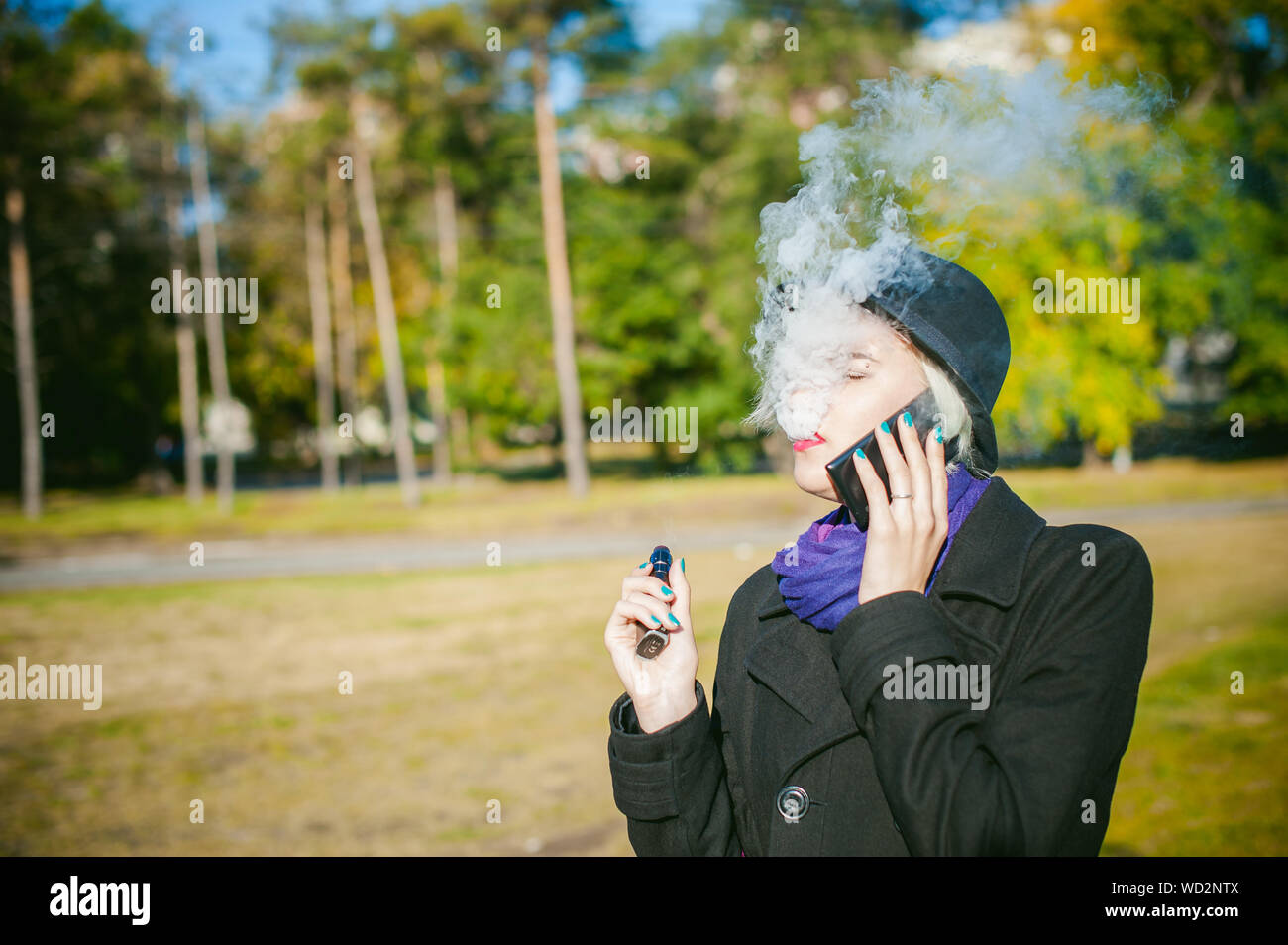 Woman Smoking On Phone High Resolution Stock Photography and Images - Alamy