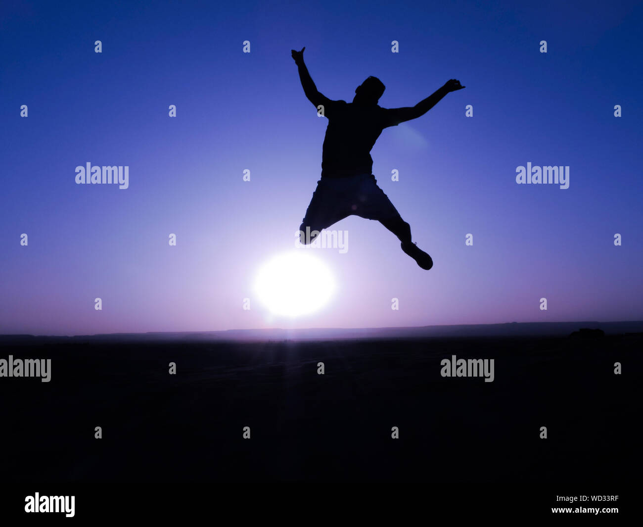 Man jumping in mid air sun hi-res stock photography and images - Alamy