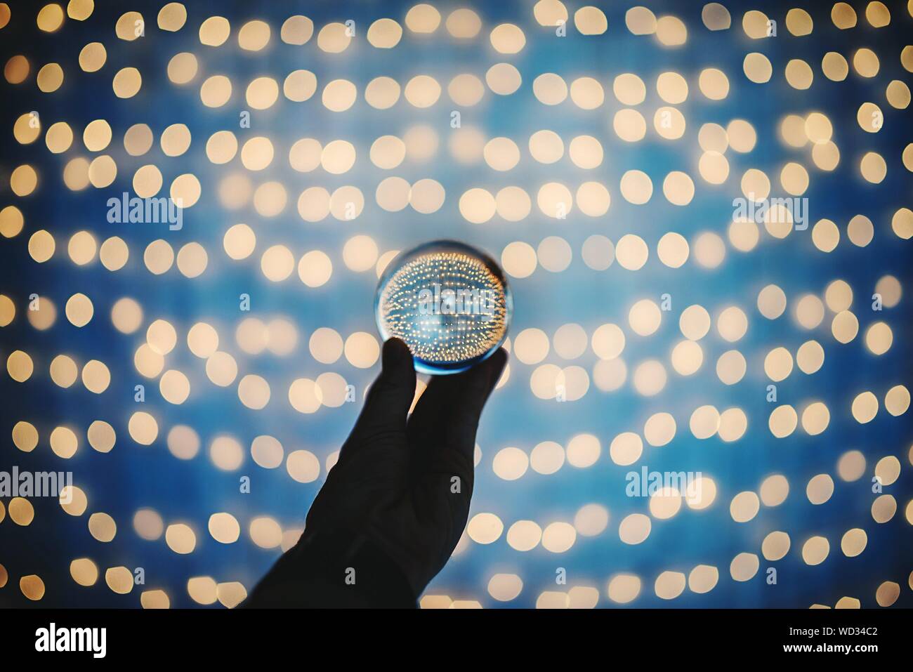 Hand and glass ball hi-res stock photography and images - Alamy