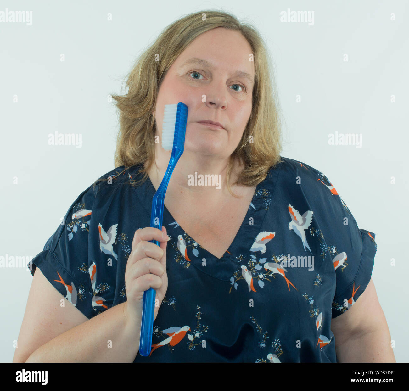 Mature woman brushing hair hi-res stock photography and images - Alamy