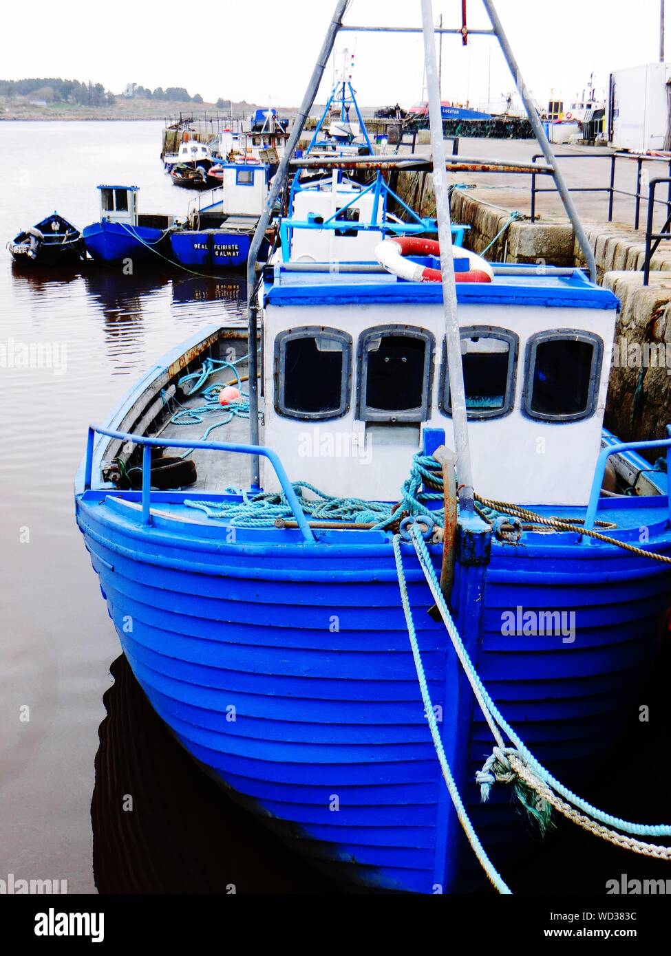 Blue fishing boat hi-res stock photography and images - Alamy