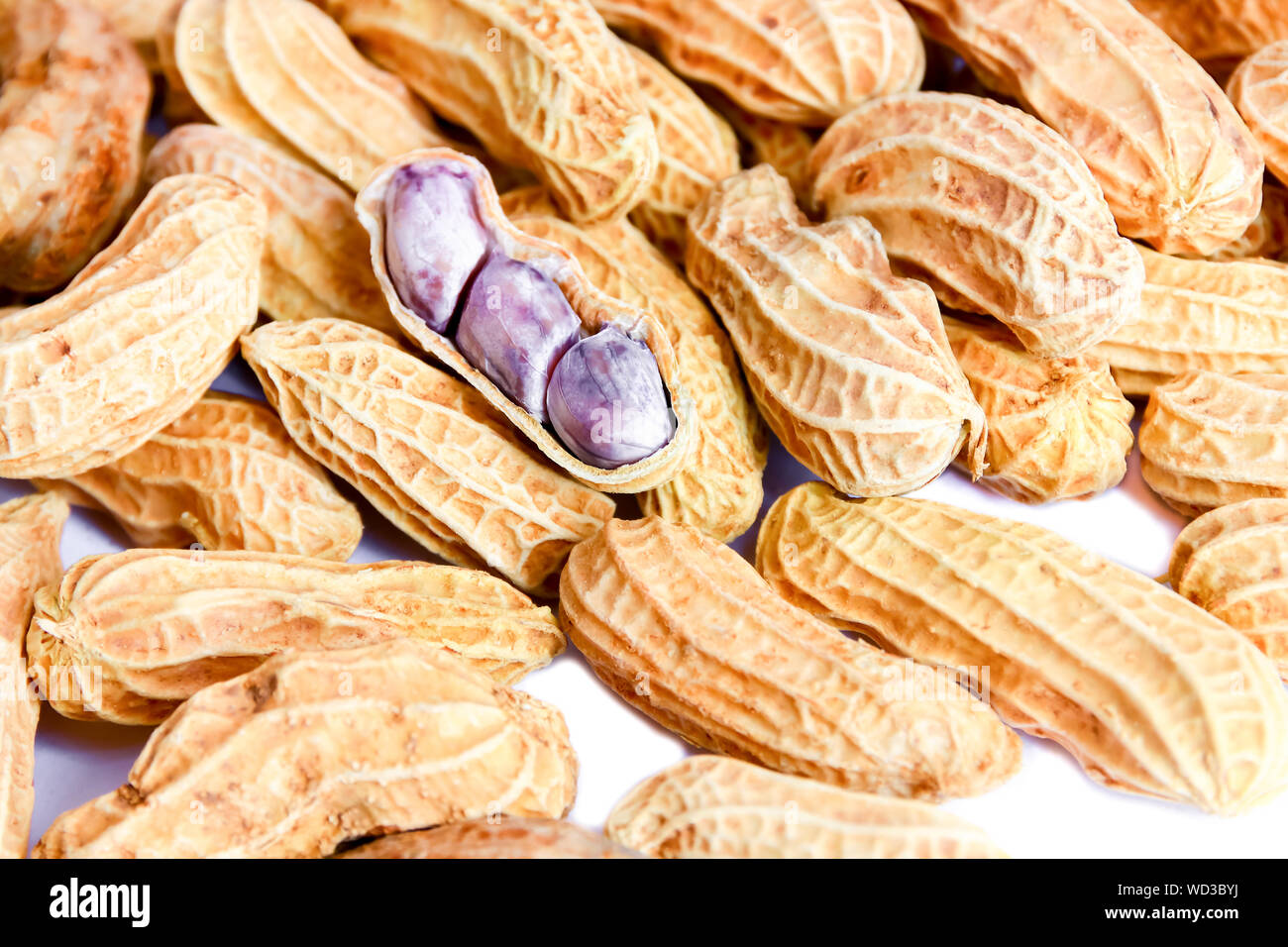 peanut group. nuts close up on white background Stock Photo - Alamy