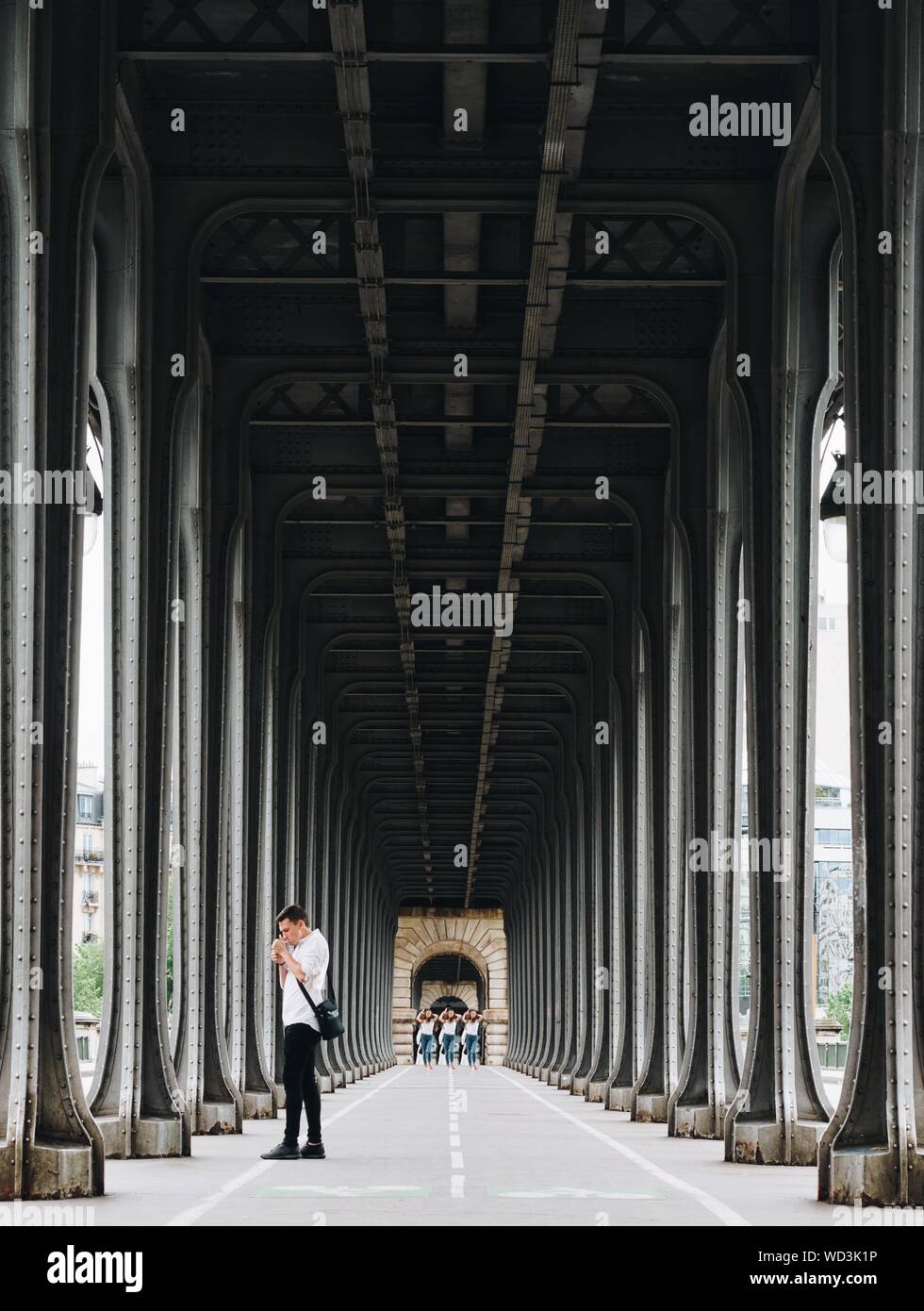 Walking under arch hi-res stock photography and images - Alamy