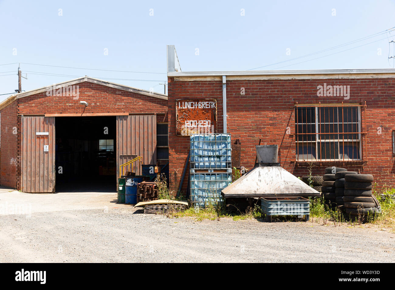 Retro factory worksite with brick building sheds Stock Photo - Alamy