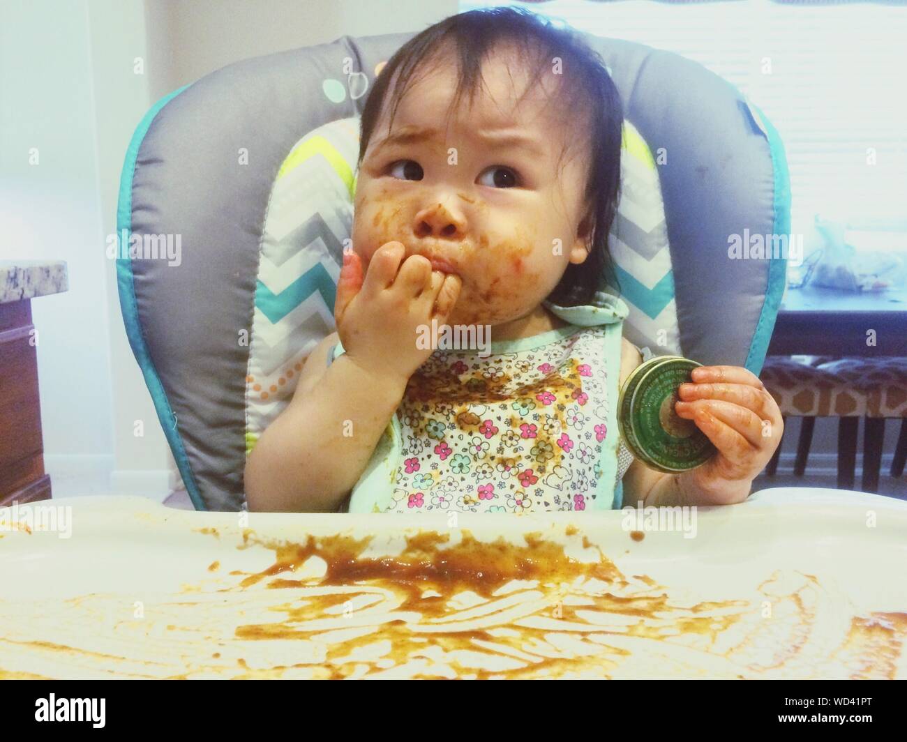 Girl holding finger mouth in hi-res stock photography and images - Alamy