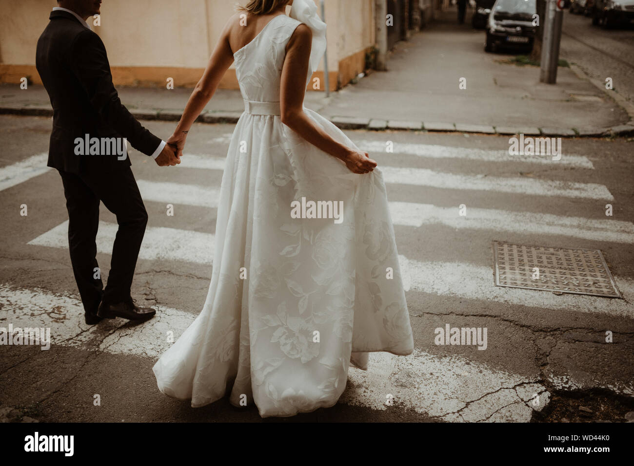 Two women crossing the road hi-res stock photography and images - Alamy