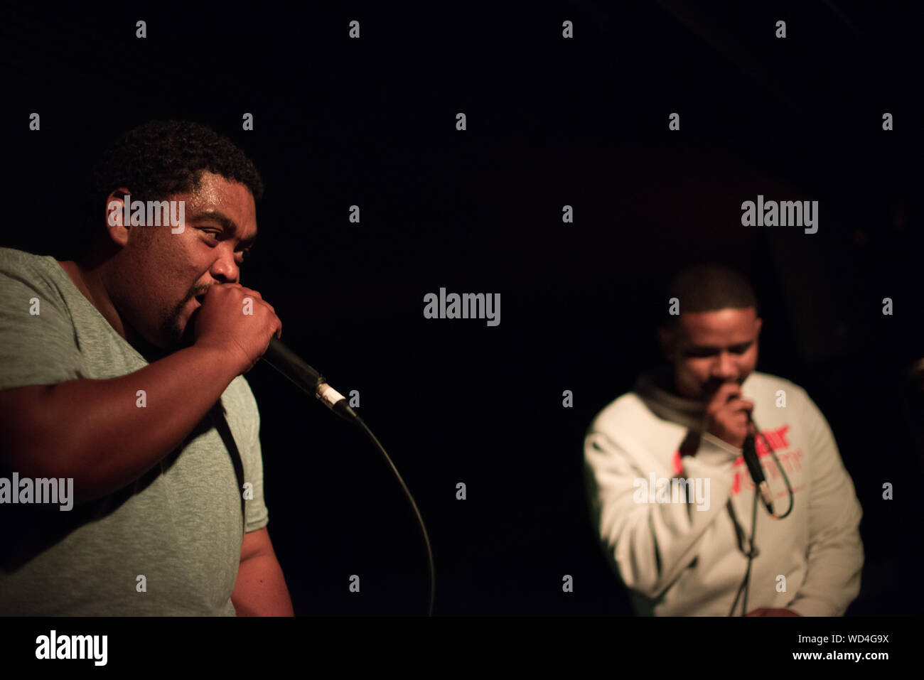 Singers Performing Against Black Background Stock Photo - Alamy