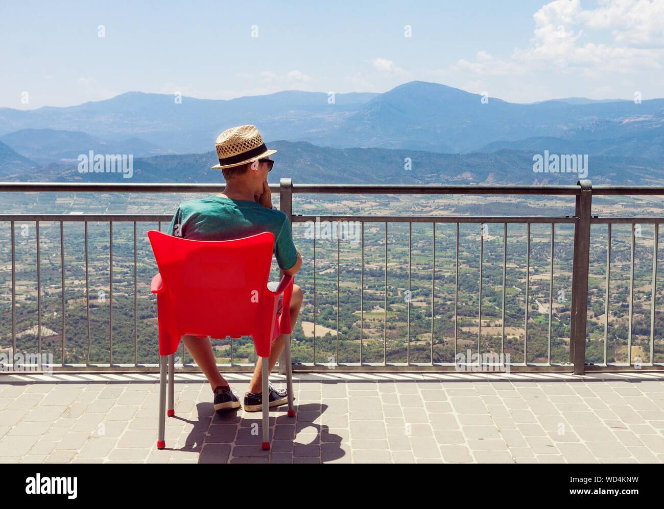Man red chair hi-res stock photography and images - Alamy