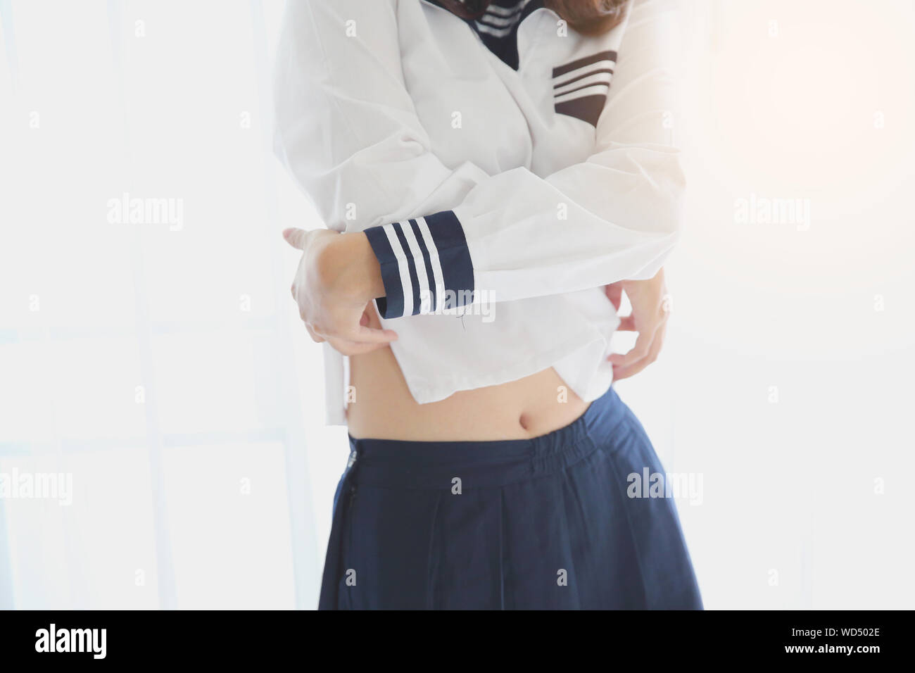 Removing Shirt High Resolution Stock Photography and Images - Alamy