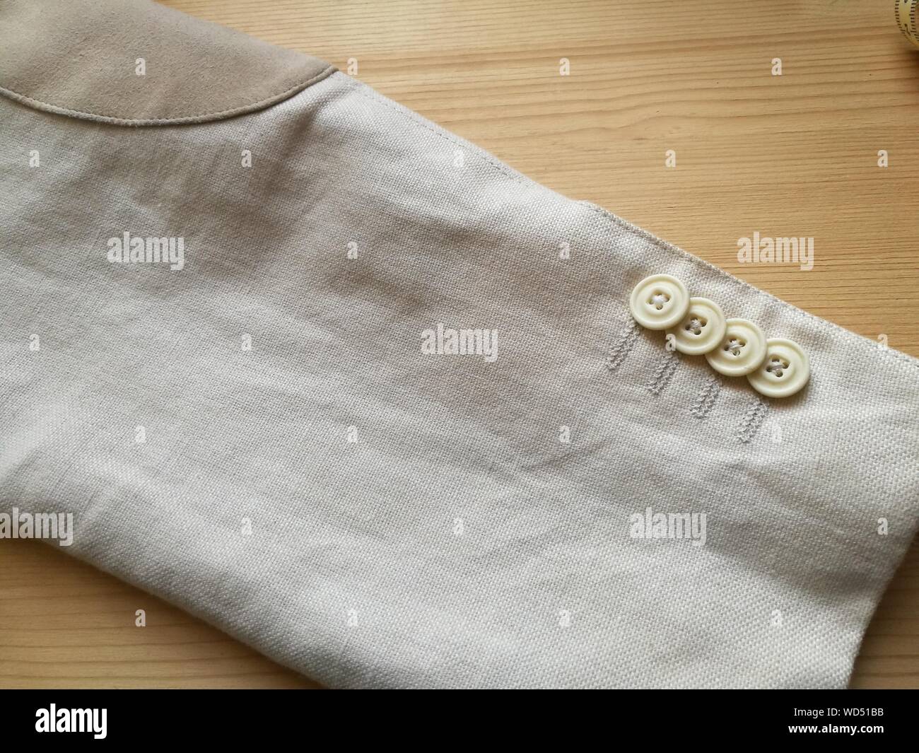 Wooden buttons on jacket hi-res stock photography and images - Alamy