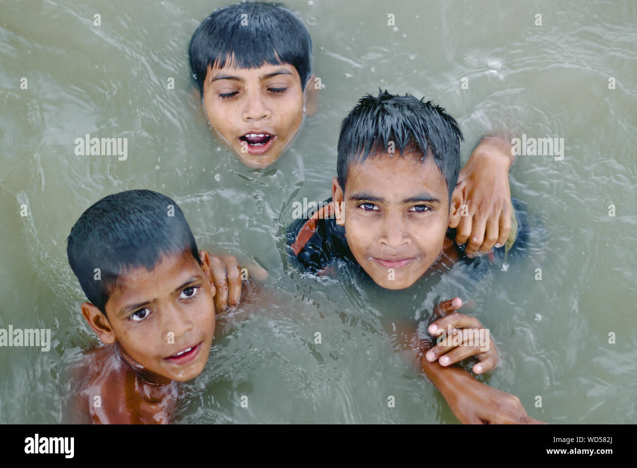 Indian boys playing in water hi-res stock photography and images - Alamy
