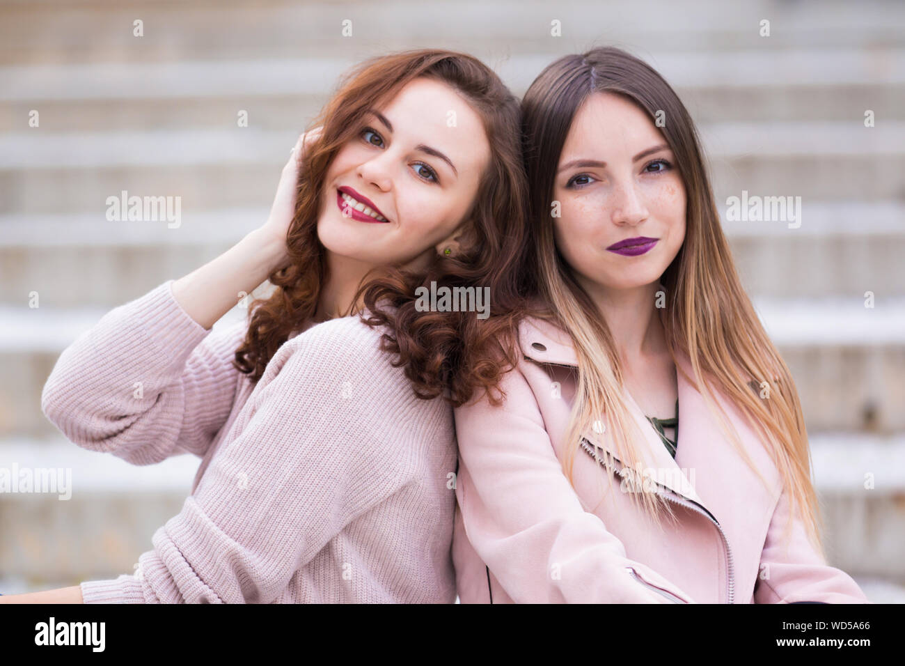 Women sitting on steps hi-res stock photography and images - Alamy