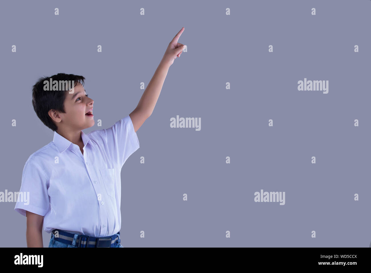 school boy pointing at something with his finger Stock Photo - Alamy