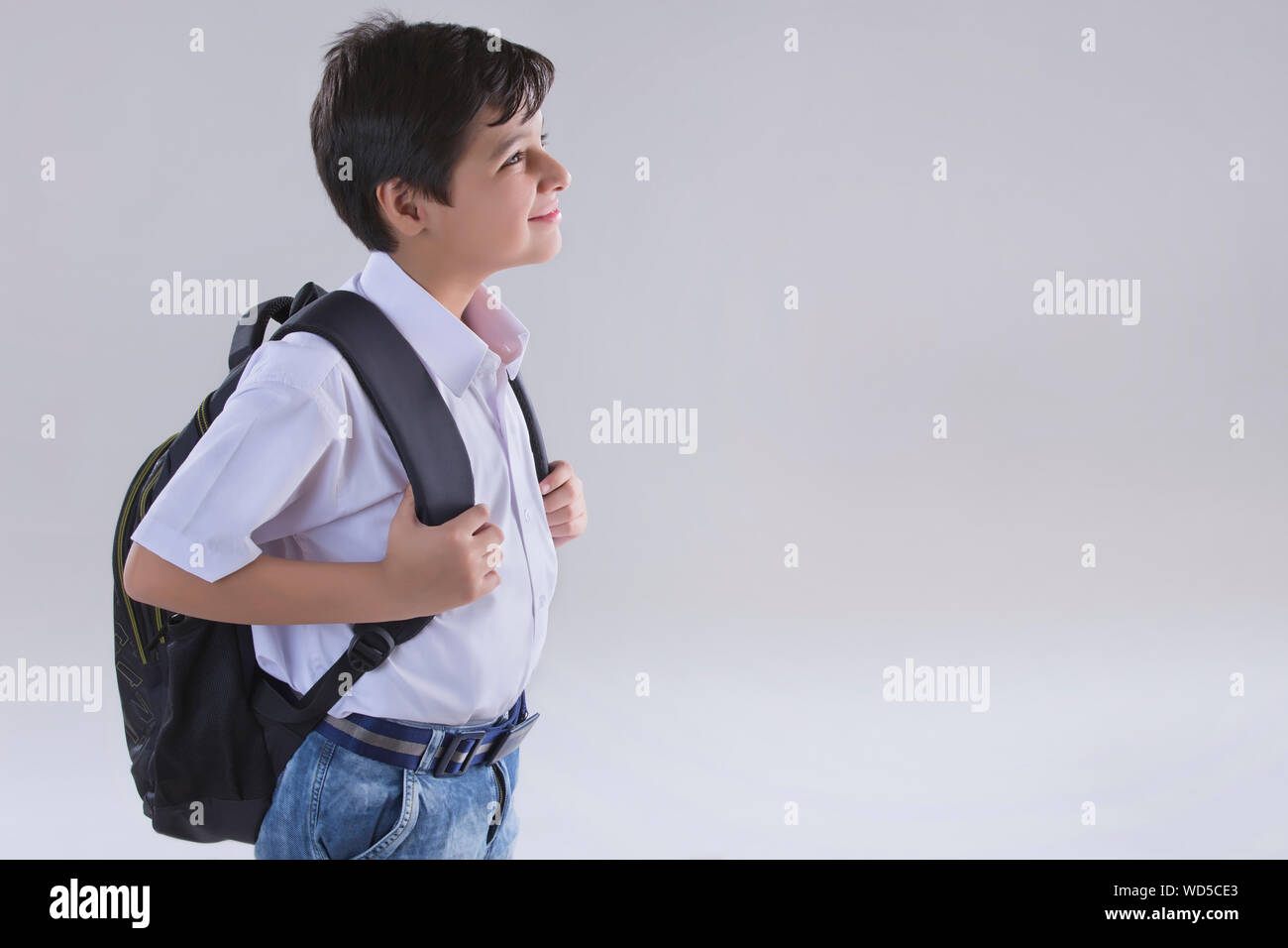 portrait of a school boy smiling at something Stock Photo - Alamy