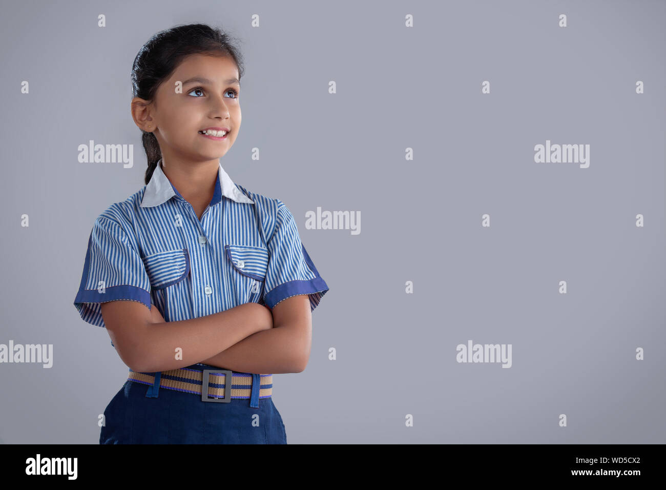 portrait of a school girl smiling at something Stock Photo - Alamy