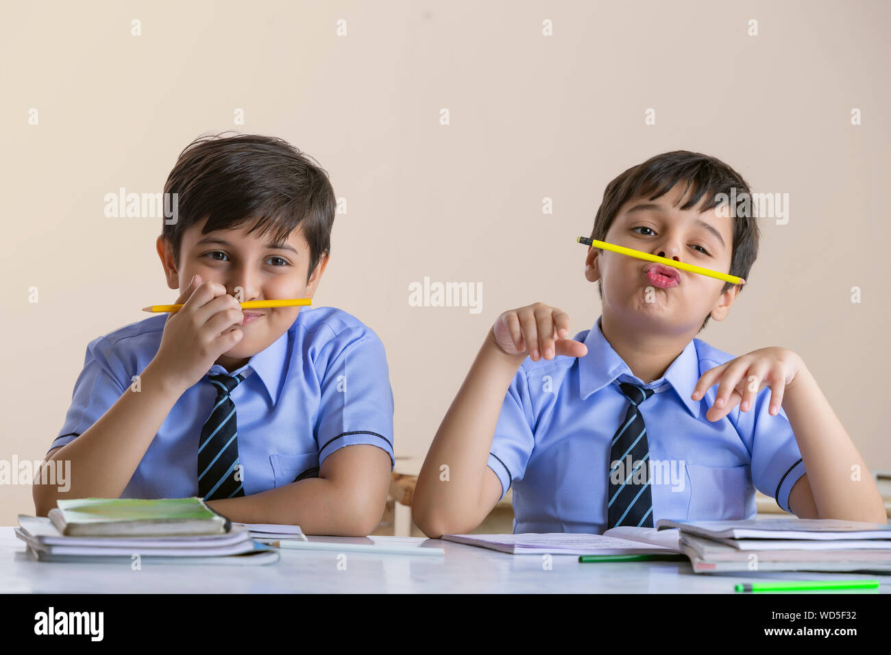 Kids playing in school uniform hi-res stock photography and images - Alamy