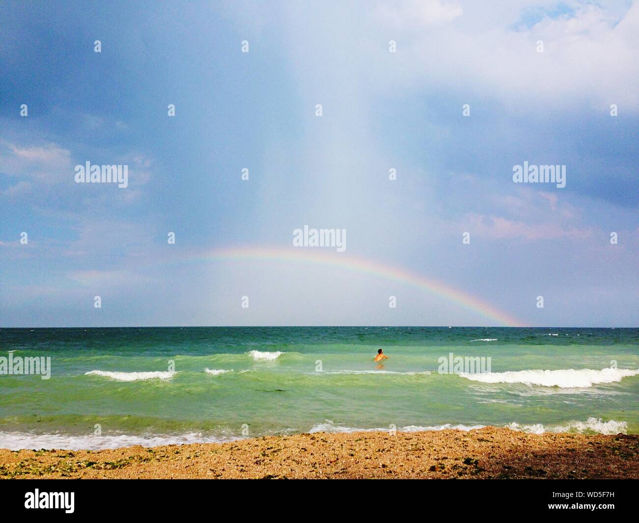 Rainbow above water hi-res stock photography and images - Alamy