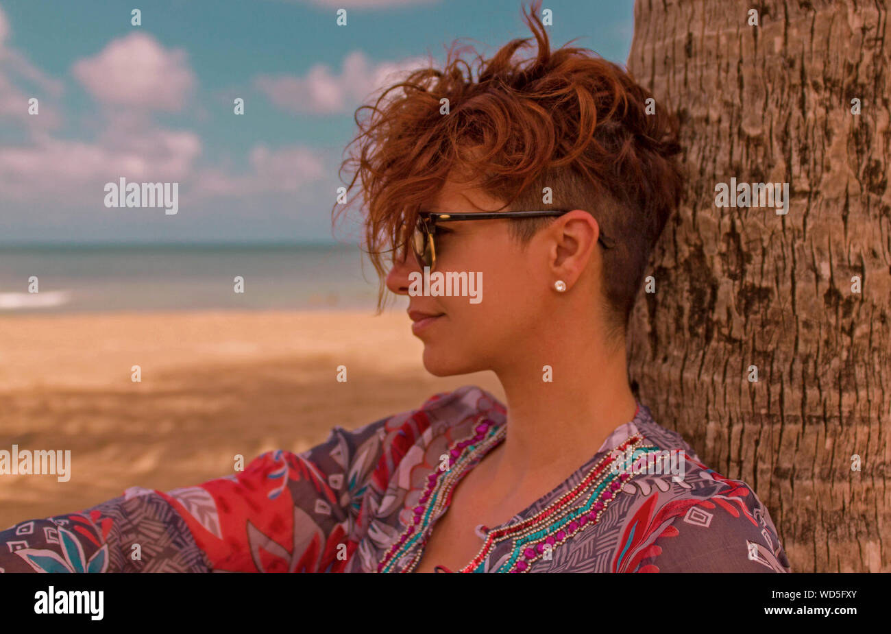 Woman Sitting Against Tree Trunk High Resolution Stock Photography and ...