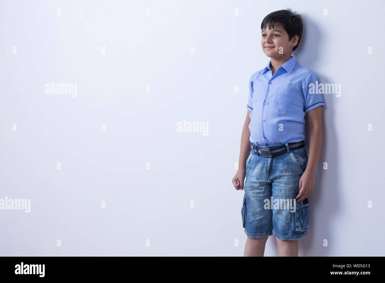 portrait of boy standing and smiling Stock Photo - Alamy