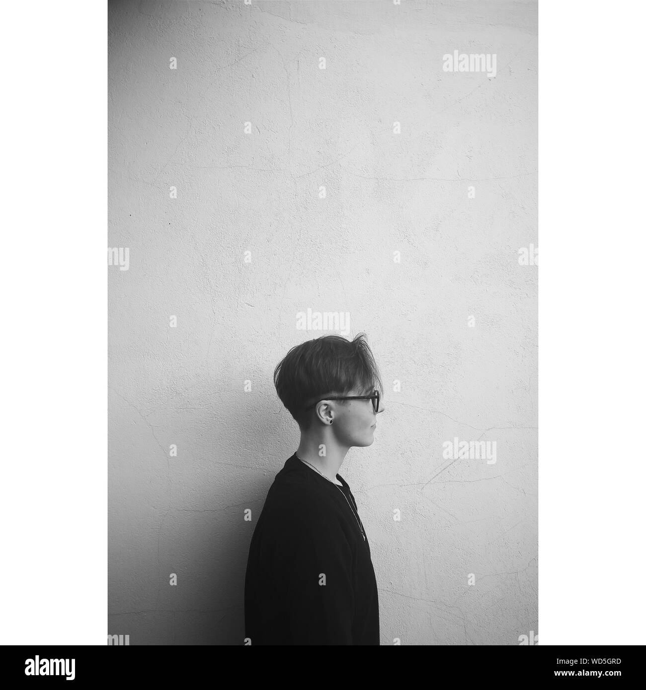 Side profile young man standing hi-res stock photography and images - Alamy