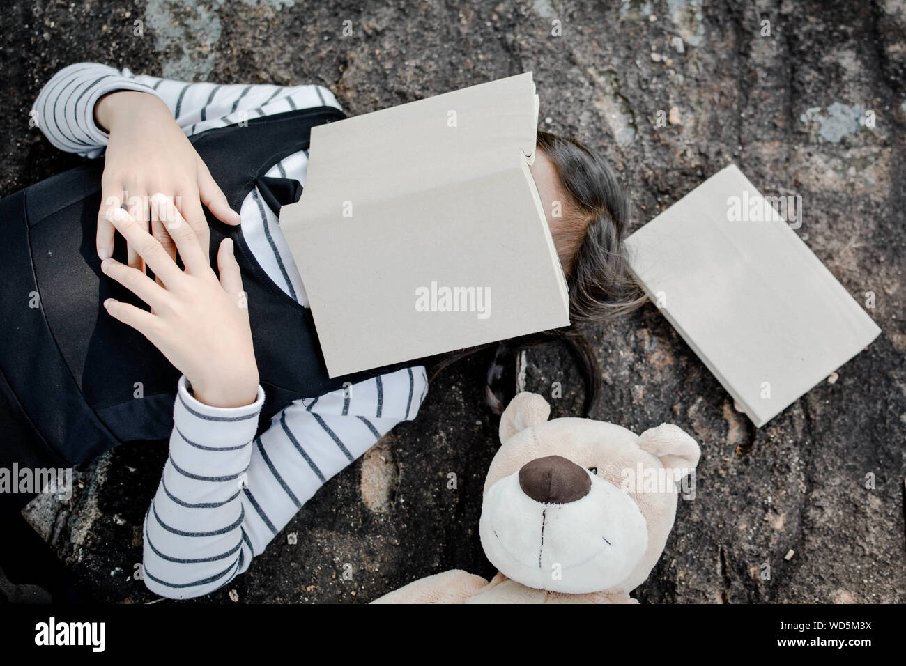 Book face down hi-res stock photography and images - Alamy