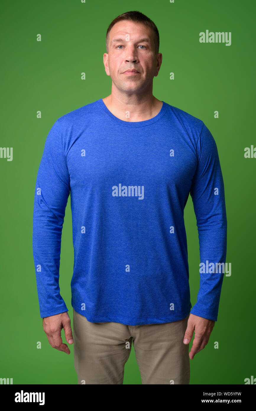 Portrait of macho mature man looking at camera Stock Photo - Alamy