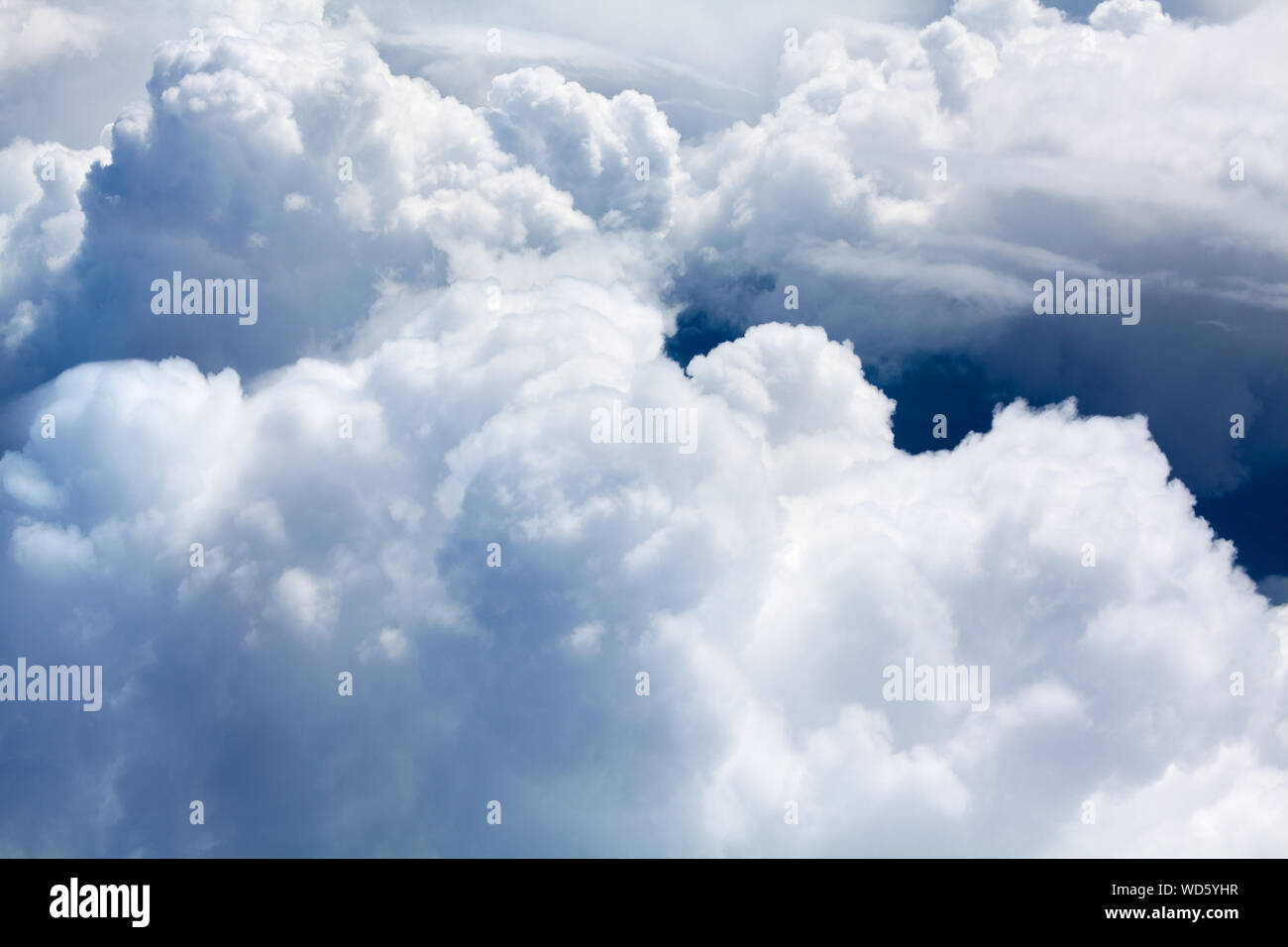 White cumulus clouds on blue sky background close up, overcast skies ...