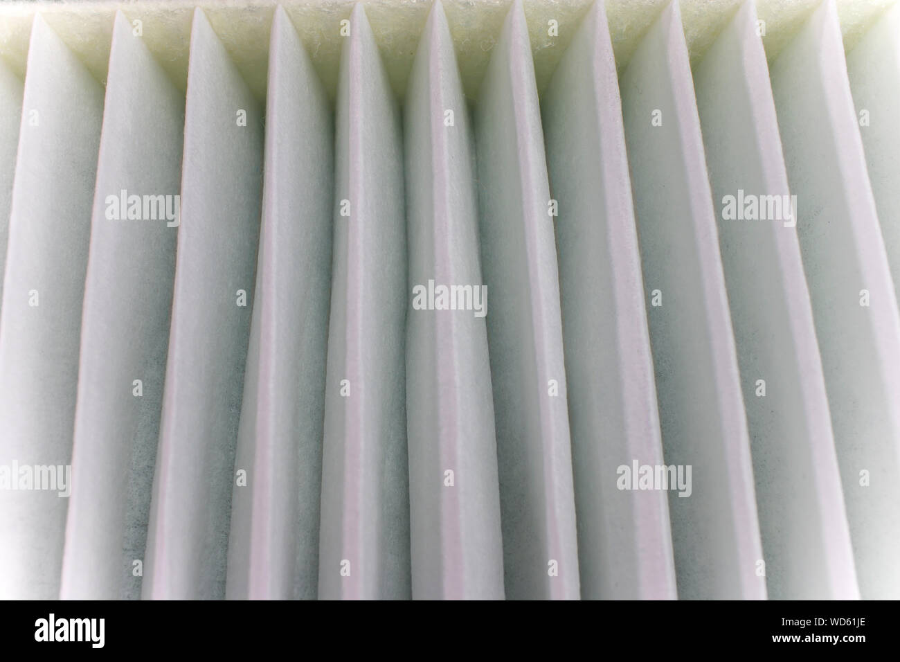 Air filter for a car on green background. Car filter close up. High ...