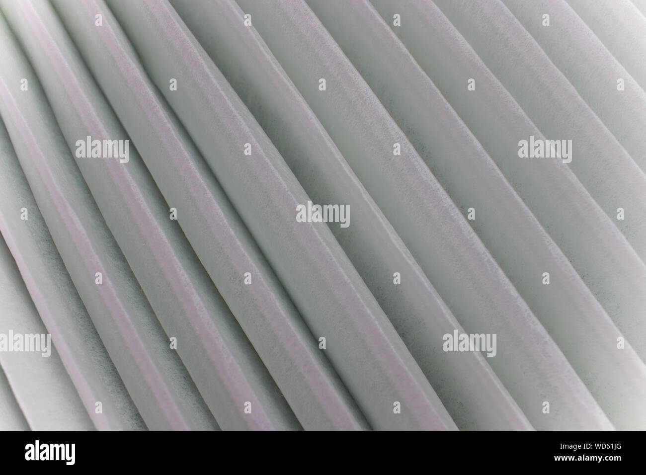 Air filter for a car on green background. Car filter close up. High ...