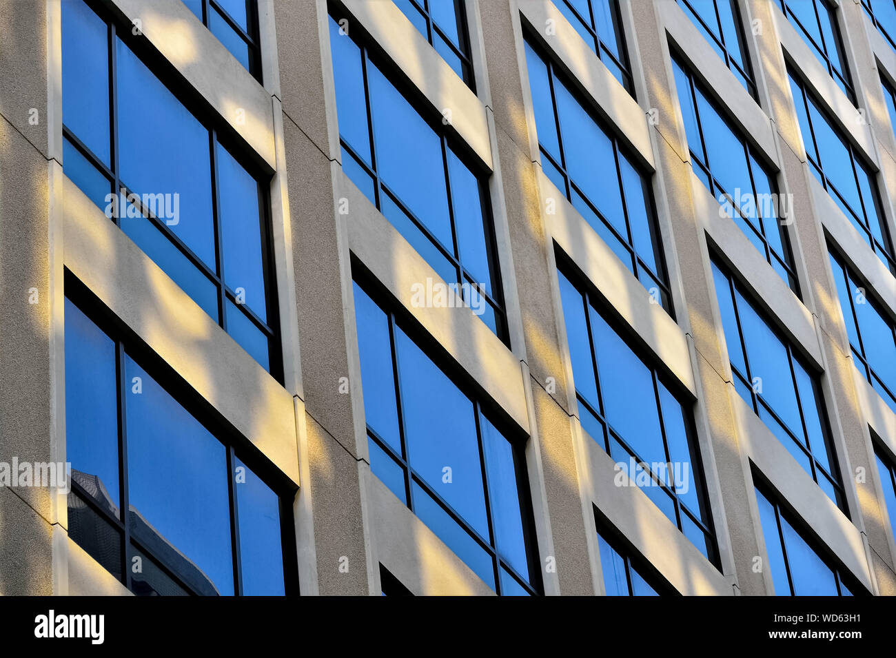 Perspective view of modern exterior of office building with geometric ...