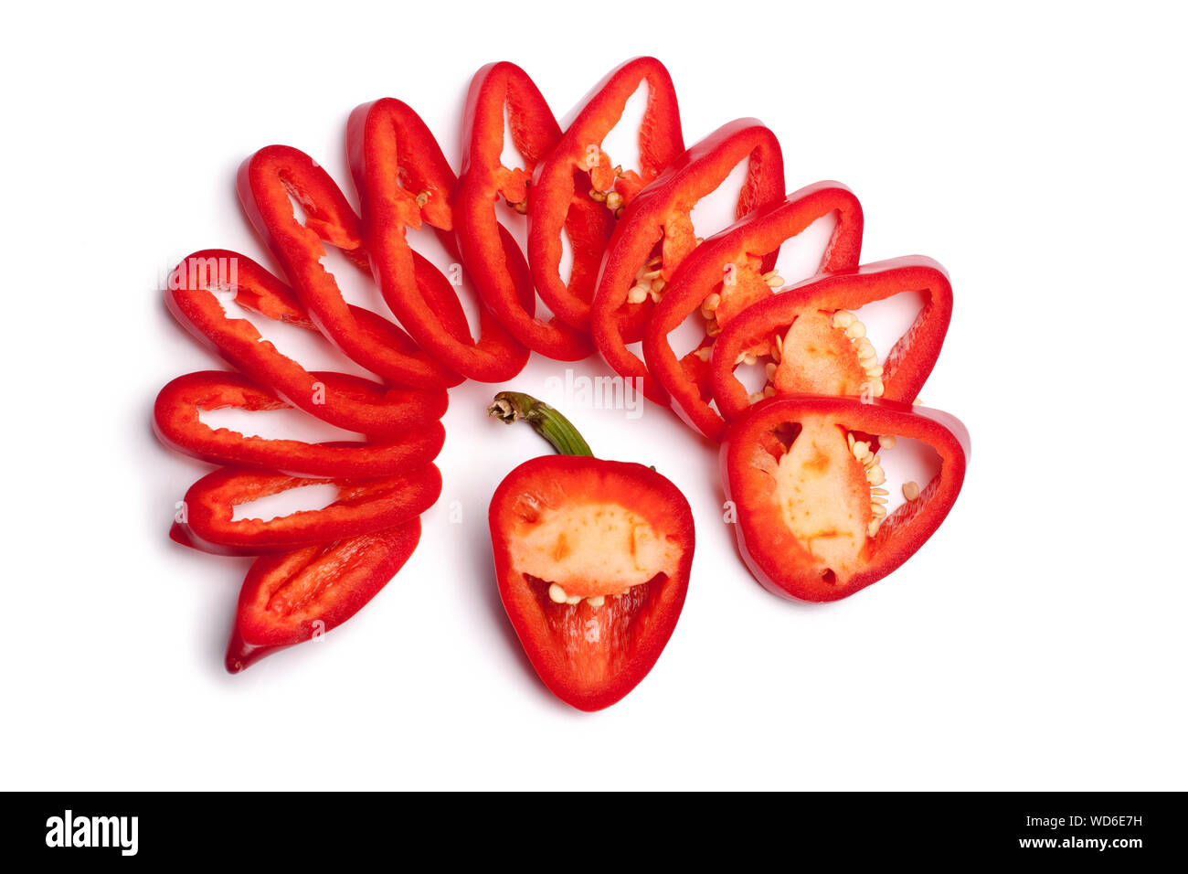 Red pepper slised in rings, a piece of pepper like a smile, looking ...
