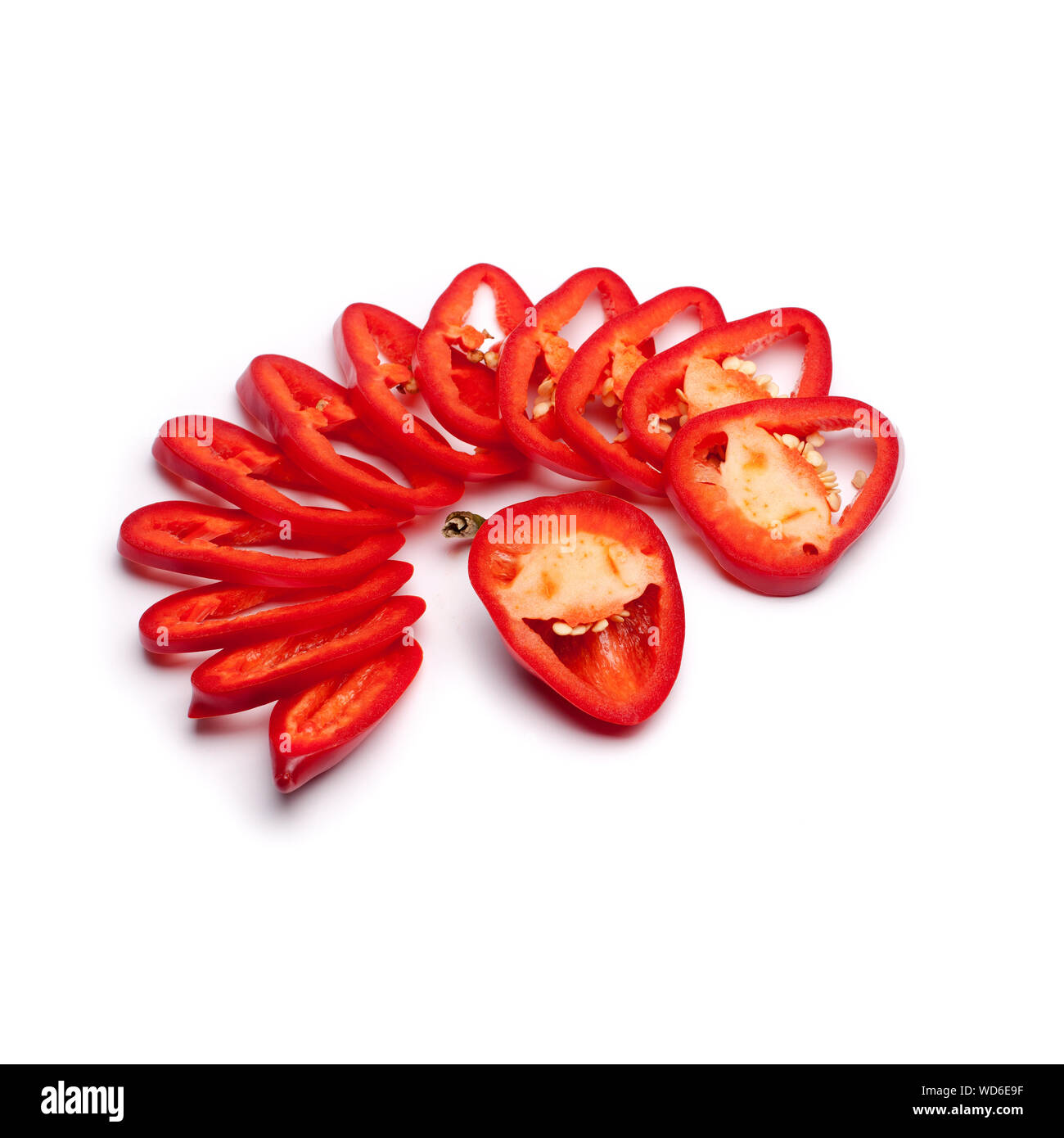 Red pepper slised in rings, a piece of pepper like a smile, looking ...