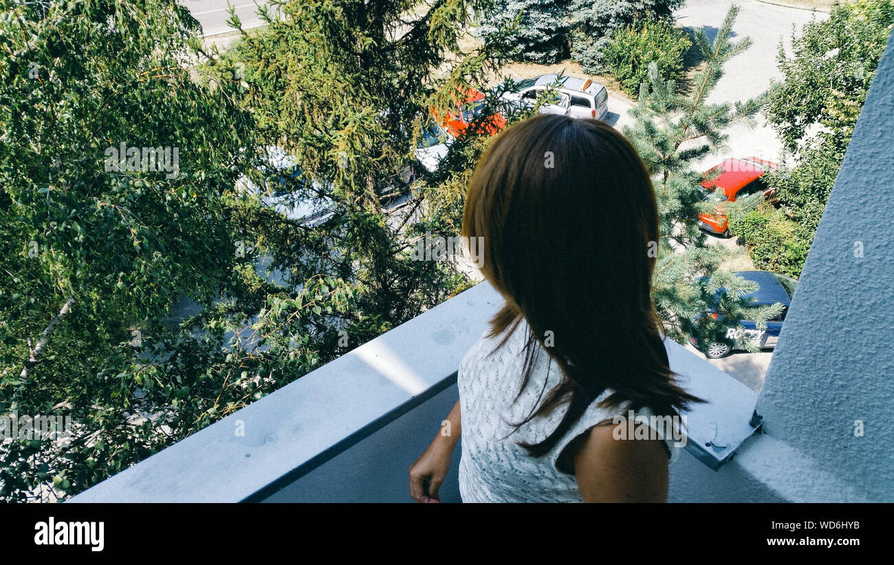 Woman at balcony hi-res stock photography and images - Alamy