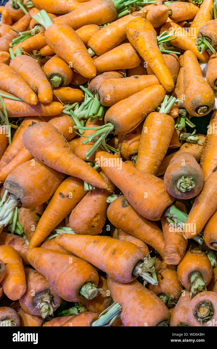Vertical photo of fresh carrots for sale at market Stock Photo - Alamy
