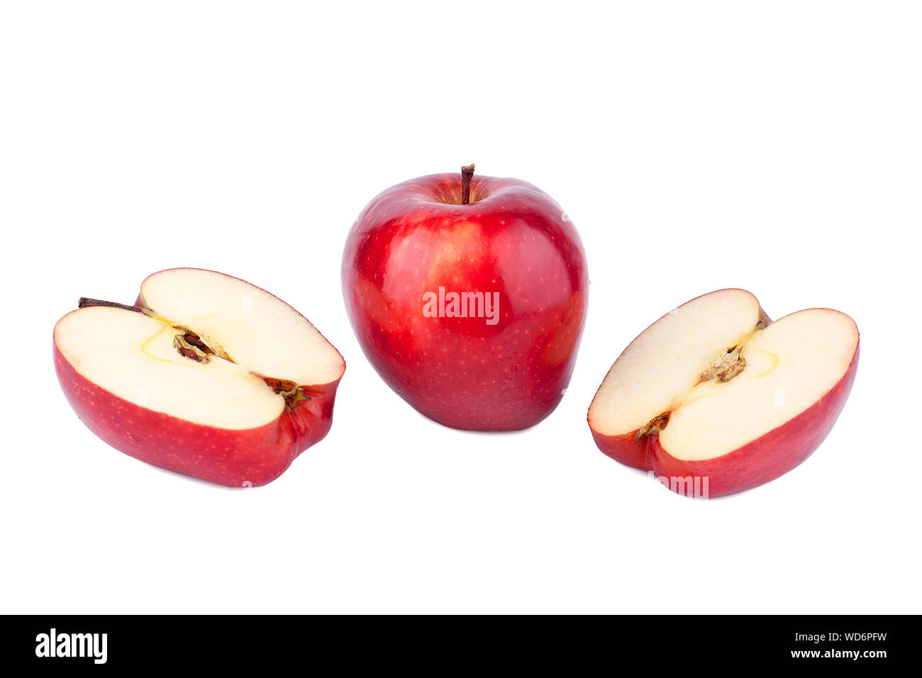 One whole red apple and two halves of apple on white background ...