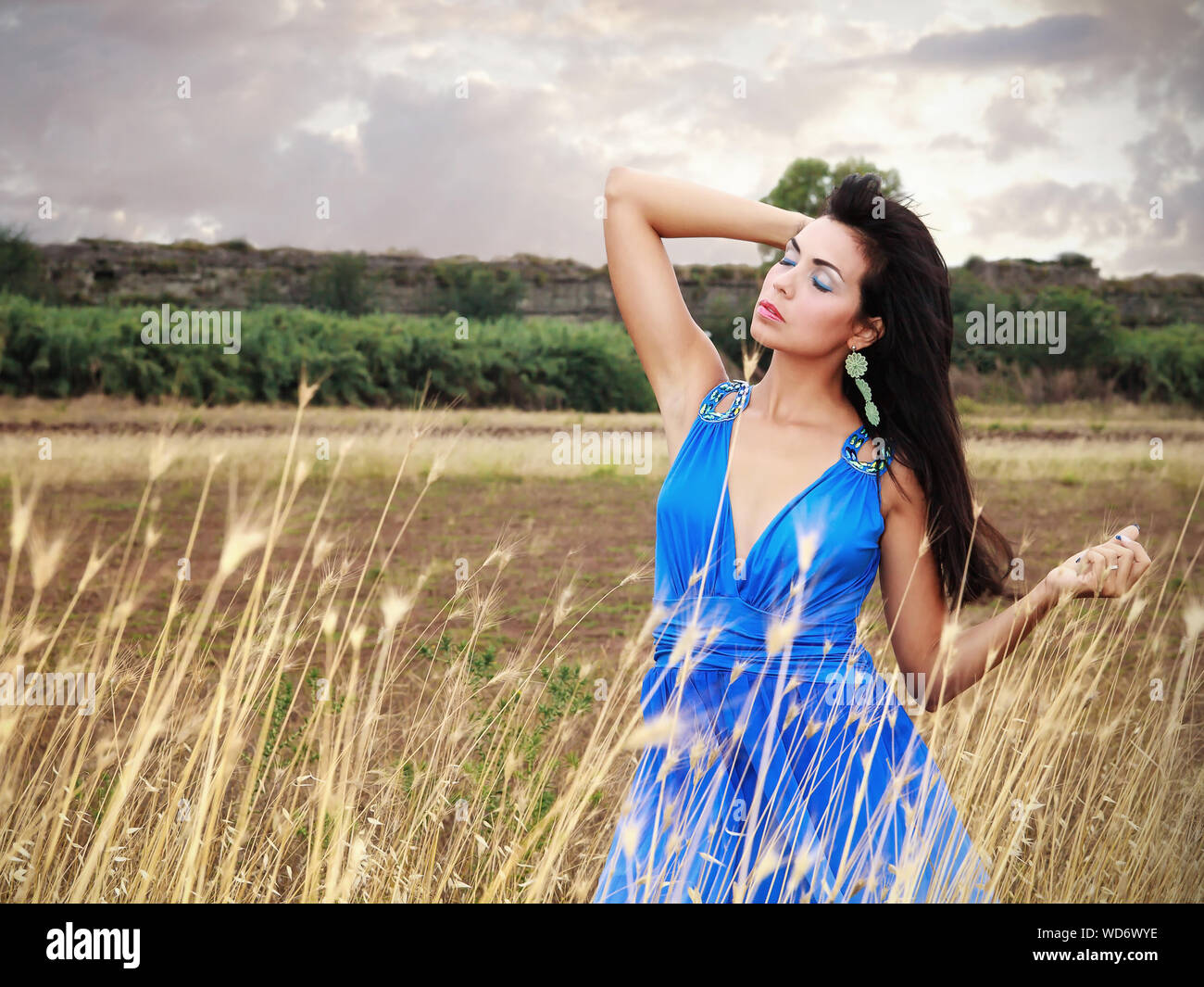 Woman wearing blue summer dress hi-res stock photography and images - Alamy