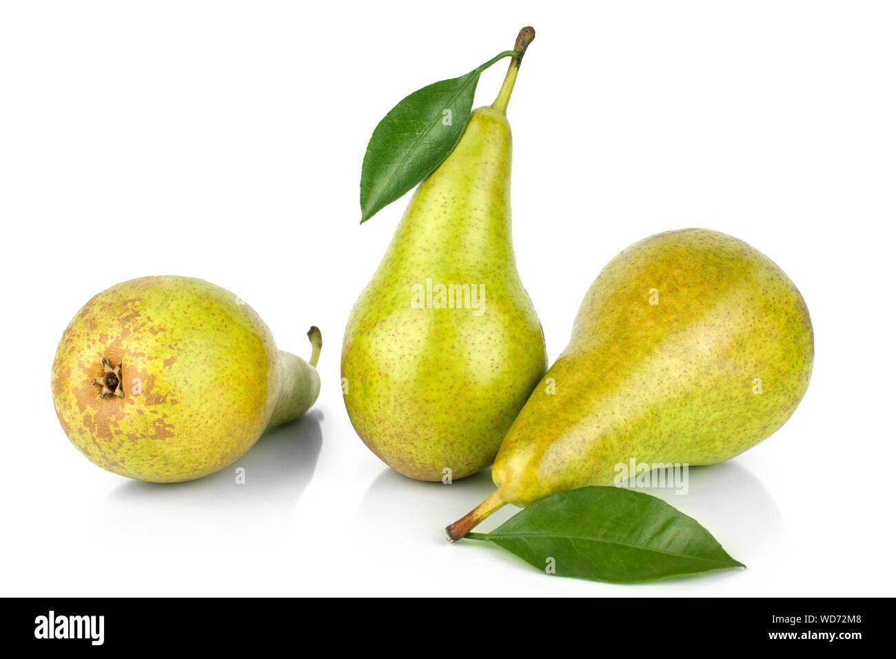 Three pears with green leaves on white background isolated close up ...
