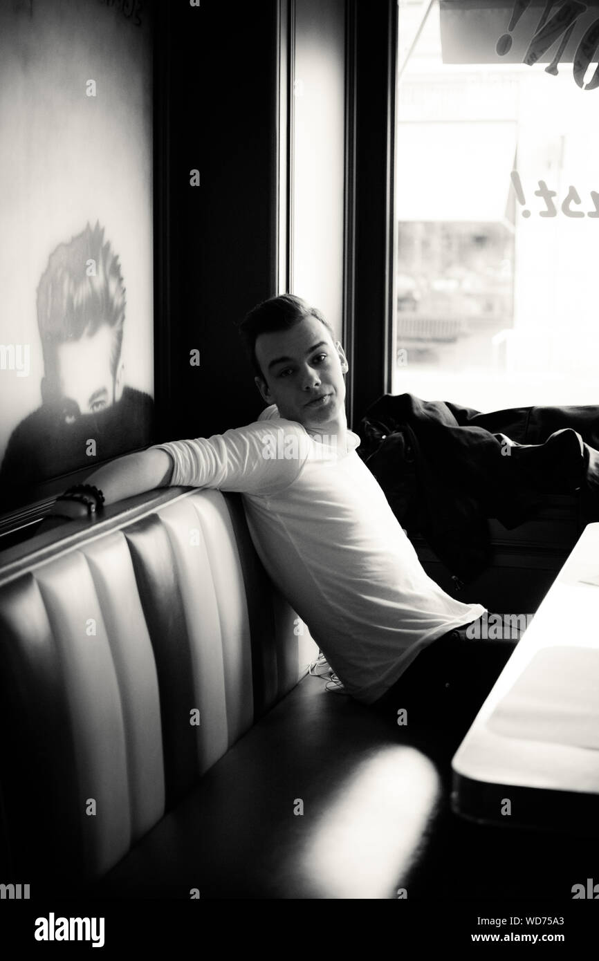 Man sitting in cafe hi-res stock photography and images - Alamy