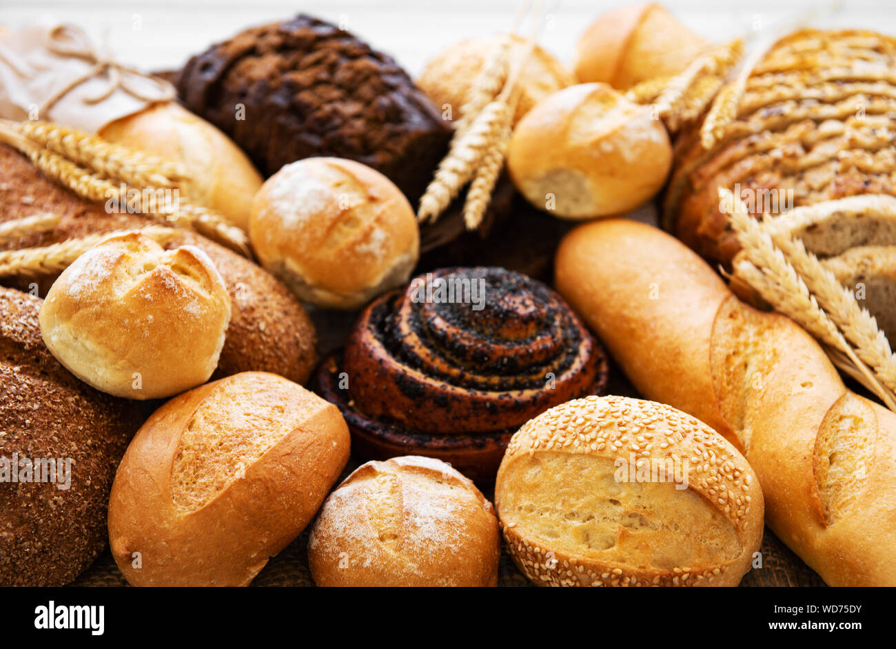 Assortment of baked bread as a food background Stock Photo - Alamy