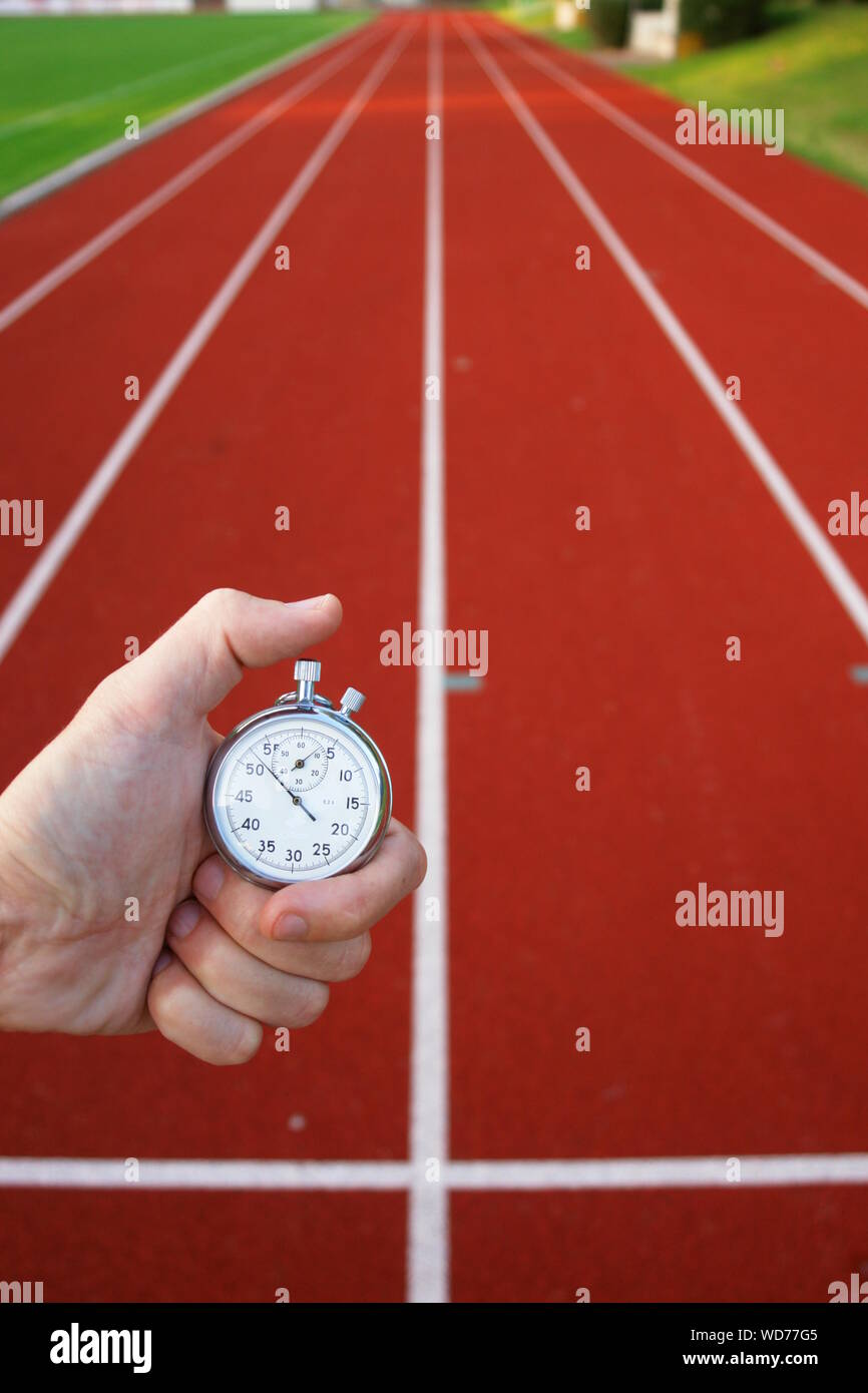 Hand holding stopwatch hi-res stock photography and images - Alamy