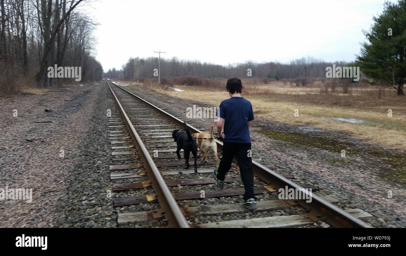 Boy on railroad track hi-res stock photography and images - Alamy