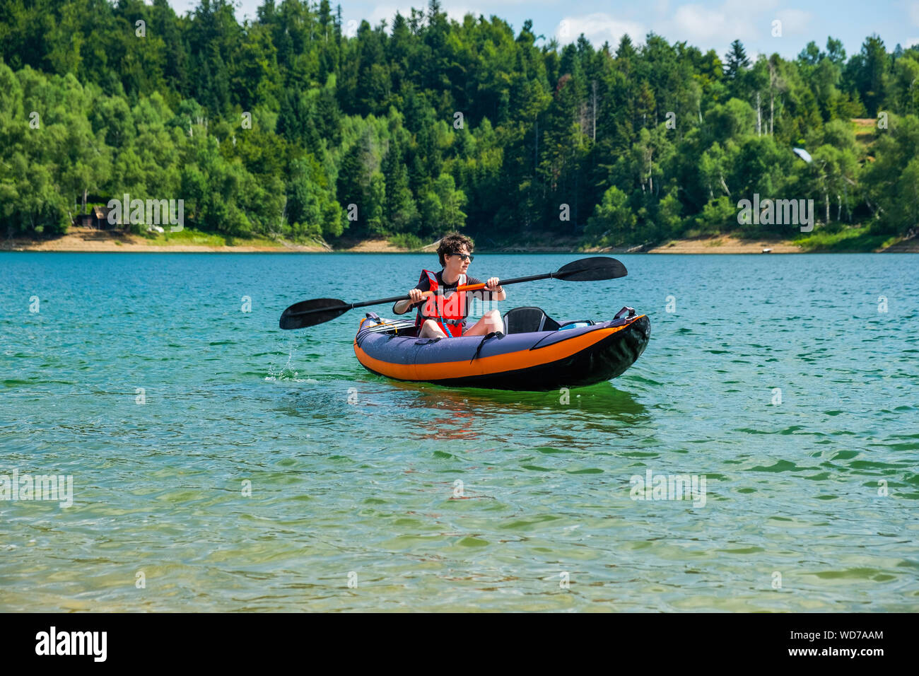 Girl on inflatable boat hi-res stock photography and images - Alamy
