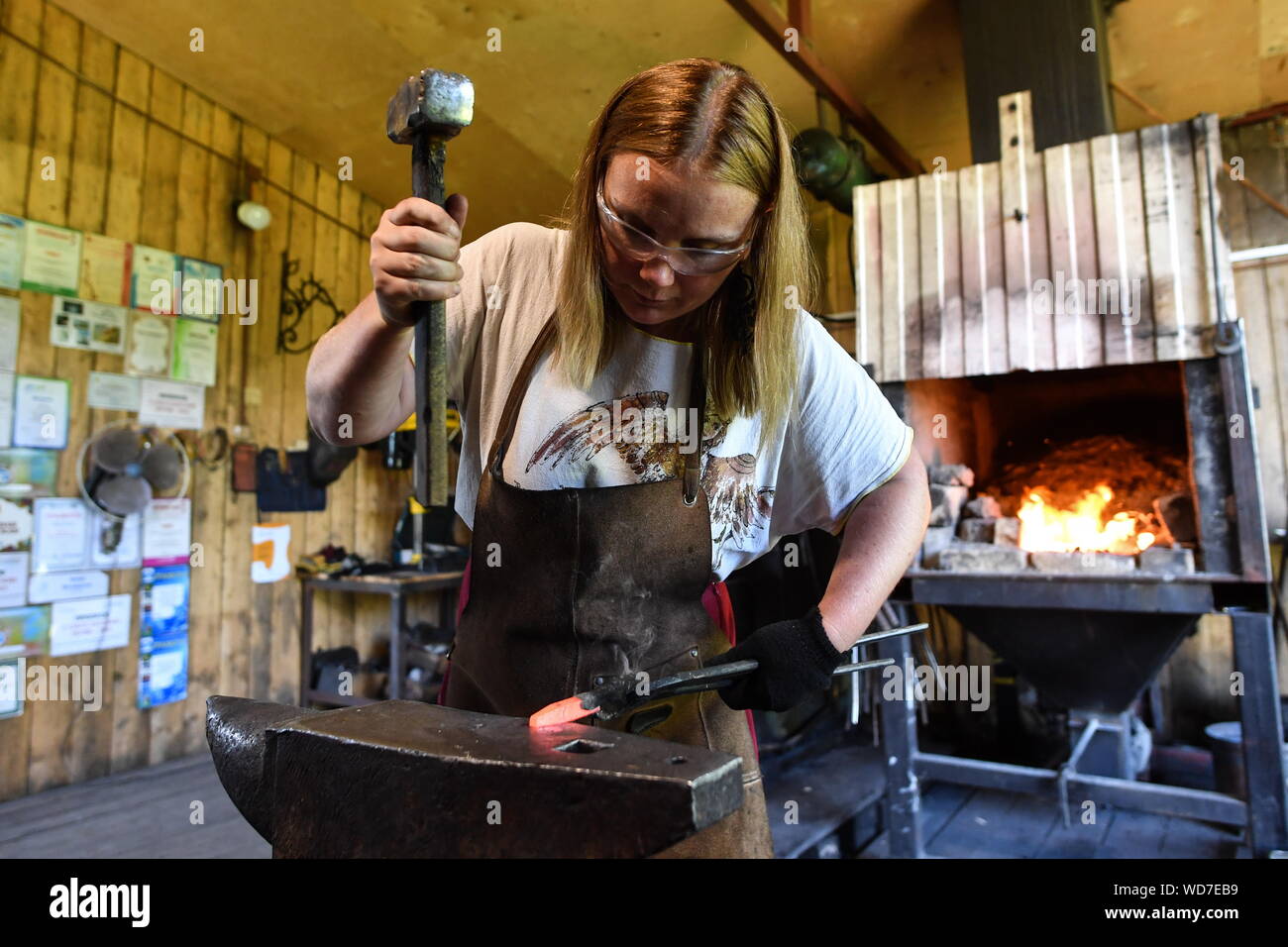 Woman Blacksmith Working In Forge High Resolution Stock Photography and ...