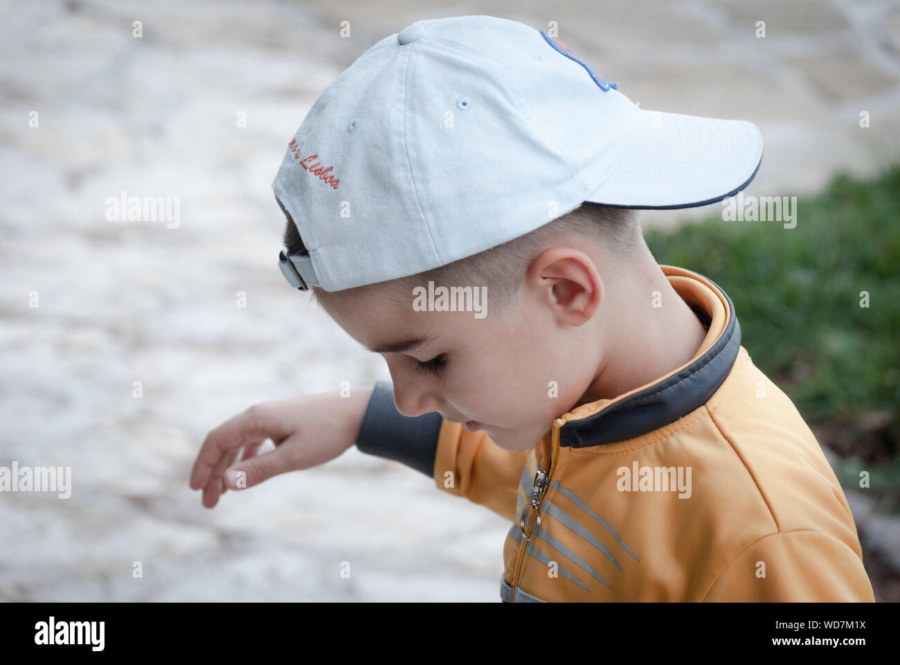 Boy looking down hi-res stock photography and images - Alamy