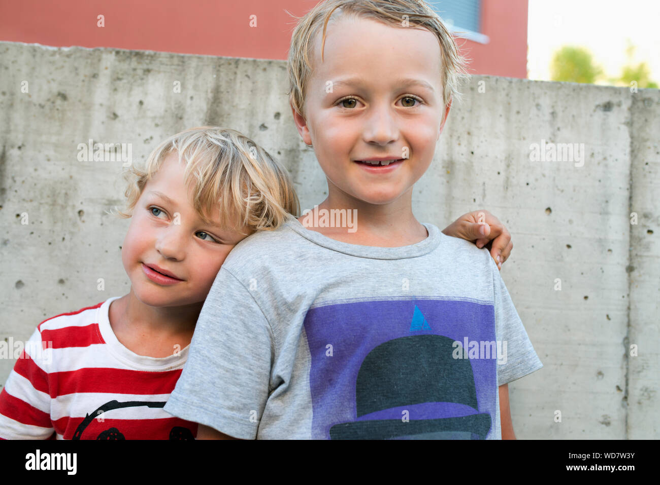 Two boys posing outdoors Stock Photo - Alamy