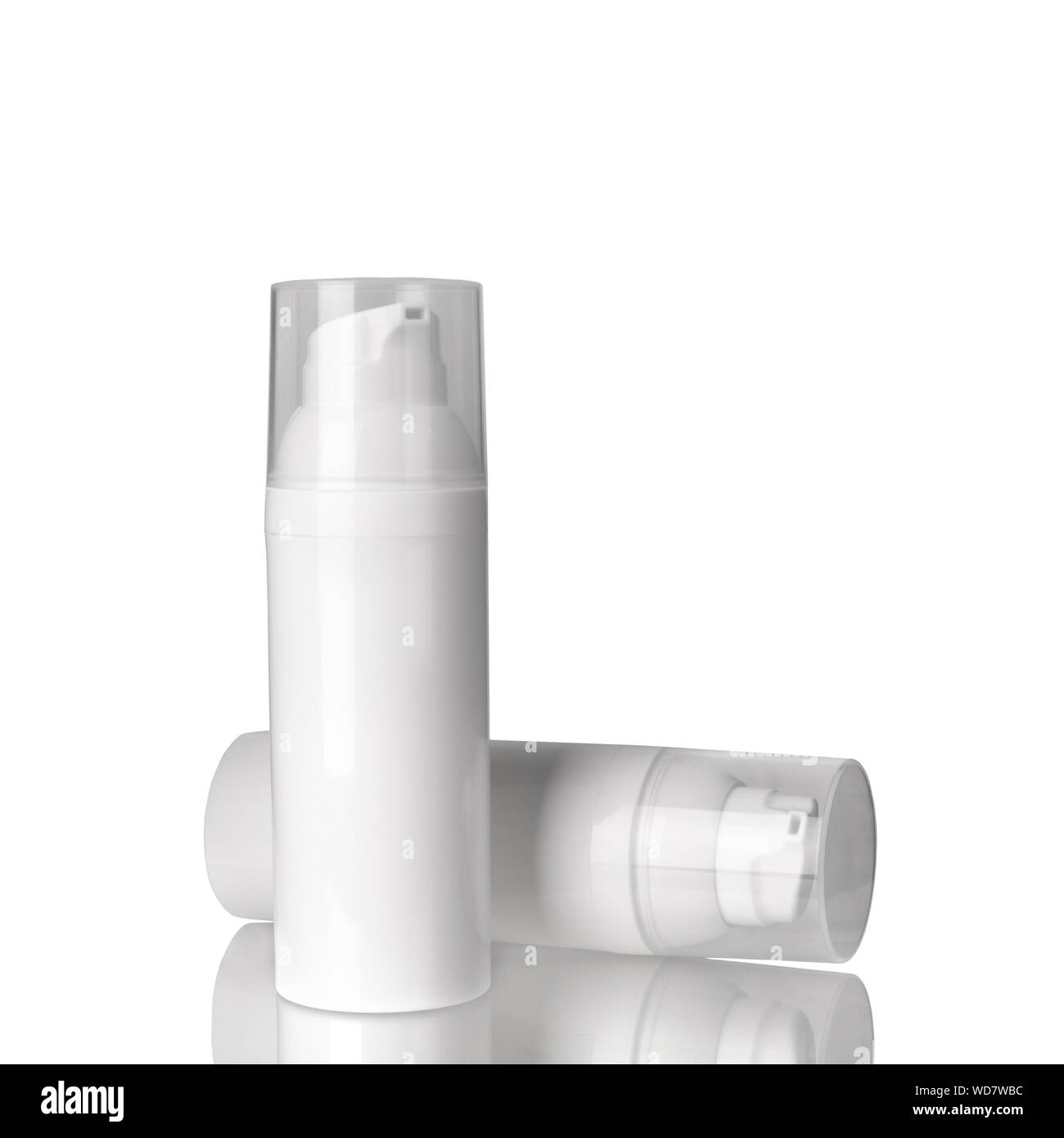 Two white cosmetic cream bottles with dispenser on white background ...