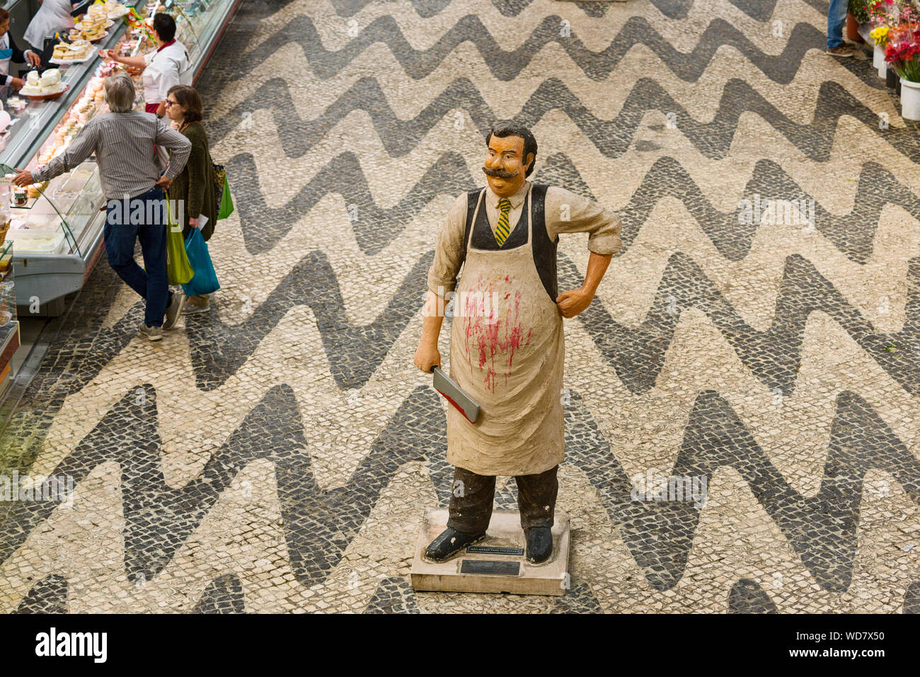 Statue of butcher inside the Mercado do Livramento food market in ...