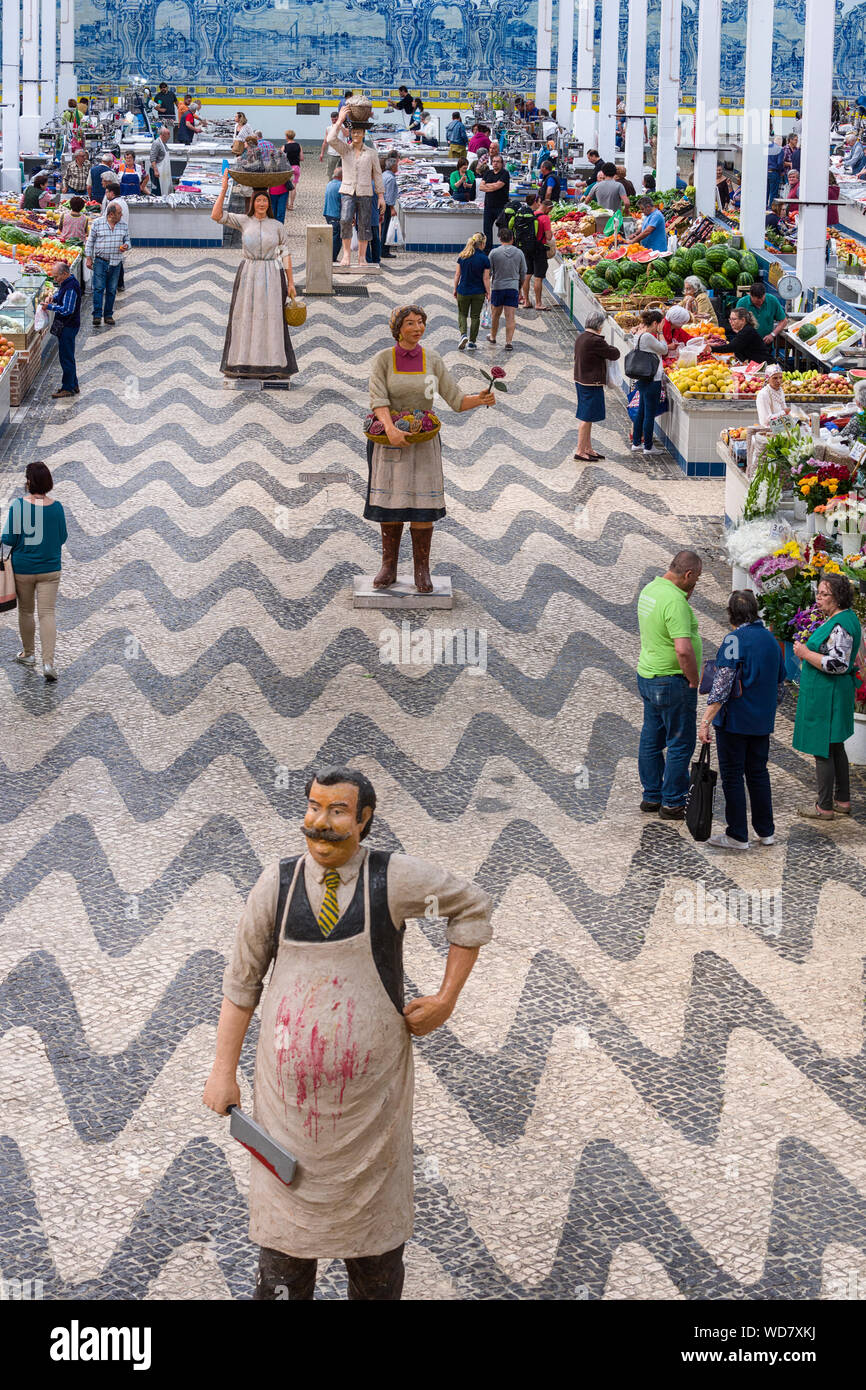 Statue of butcher and a Statue of flower seller inside the Mercado do ...