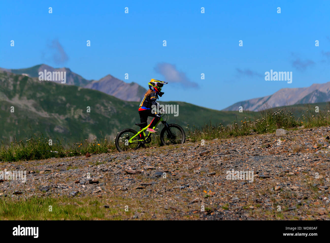 Person riding bike uphill hi-res stock photography and images - Alamy