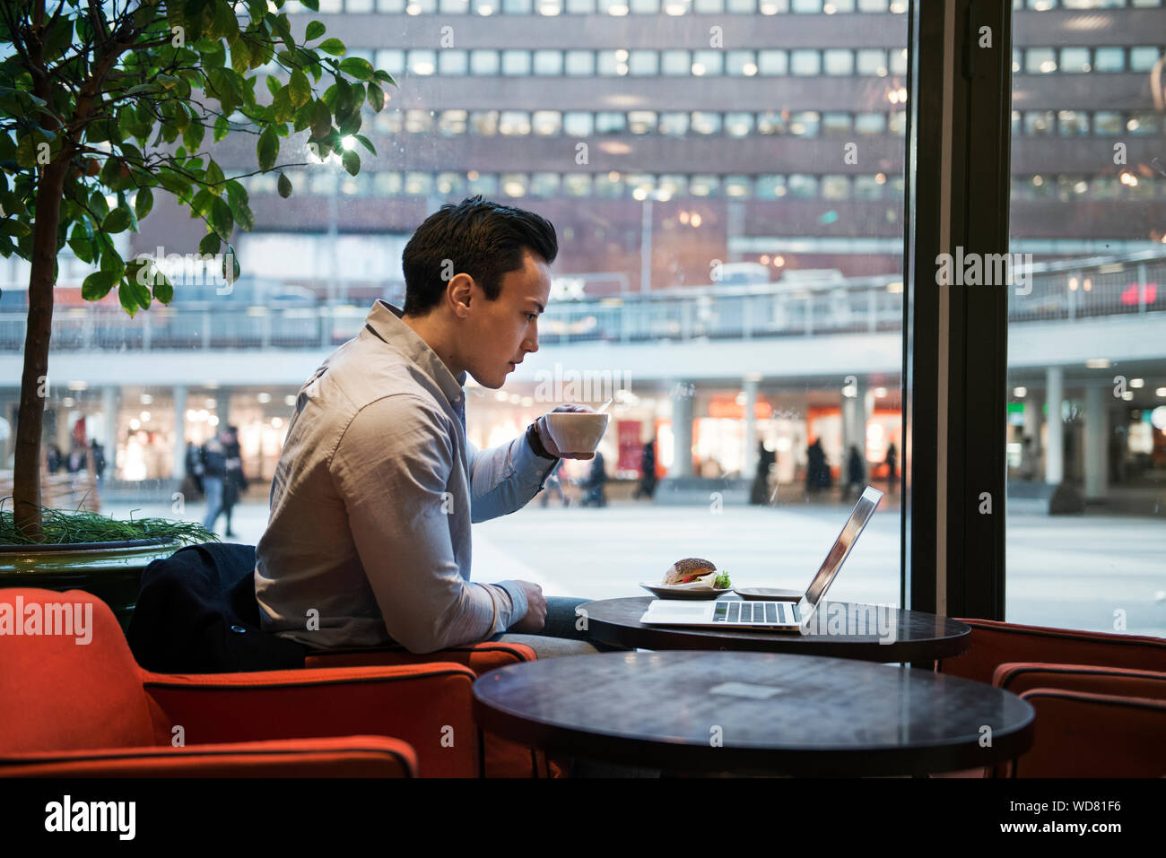 Man sitting cafe hi-res stock photography and images - Alamy